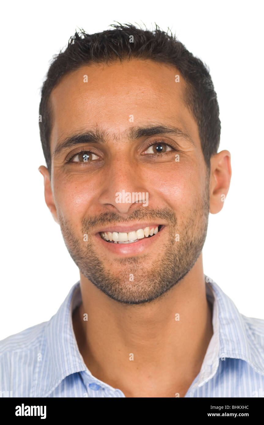 Happy ethnic man smiling against a white background Stock Photo - Alamy