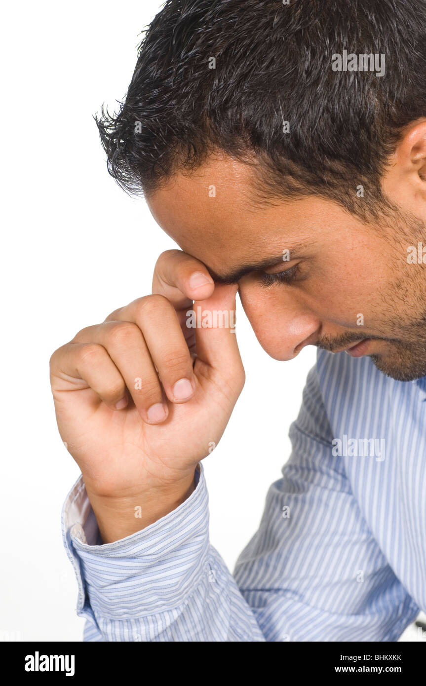 Depressed man hand on head against a white background Stock Photo - Alamy