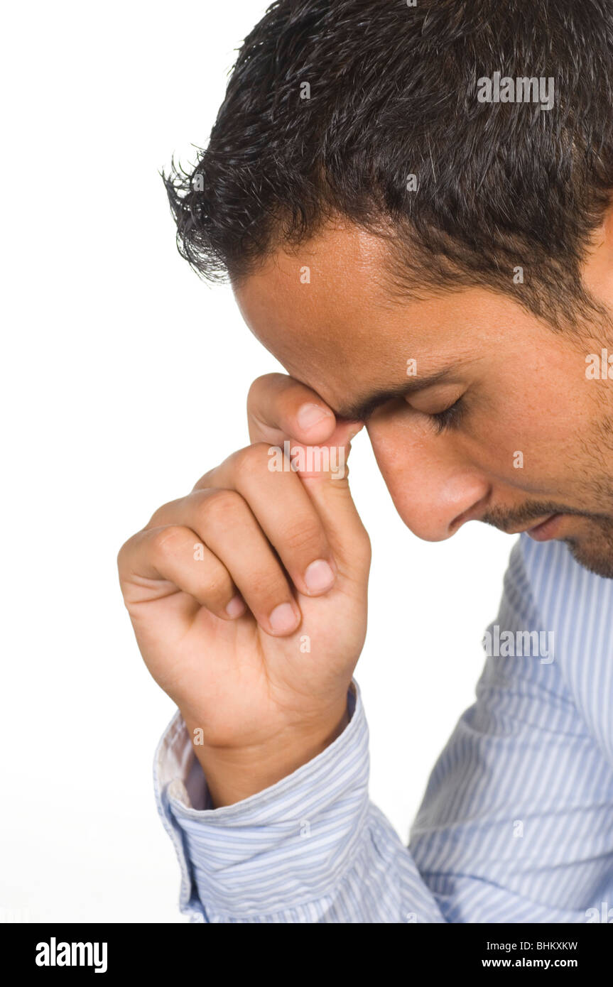 Anxious man hand on head against a white background Stock Photo - Alamy