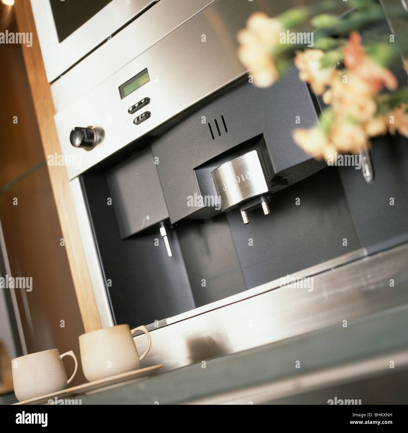 Close-up of electric coffee machine and cups Stock Photo - Alamy