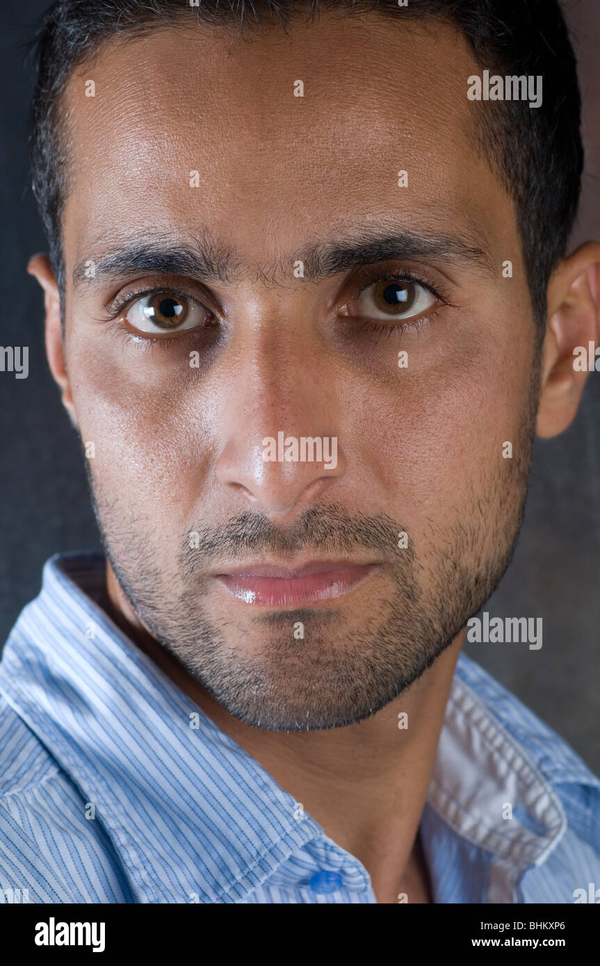 Closeup portrait of a young Arabic man looking at the camera Stock ...