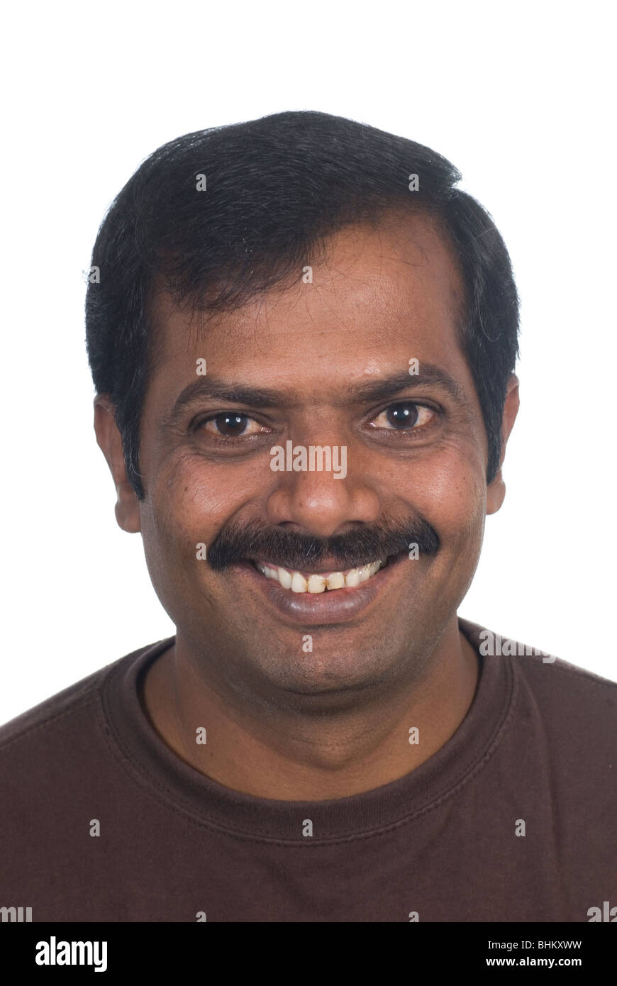 Happy Indian man smiling against a white background Stock Photo - Alamy