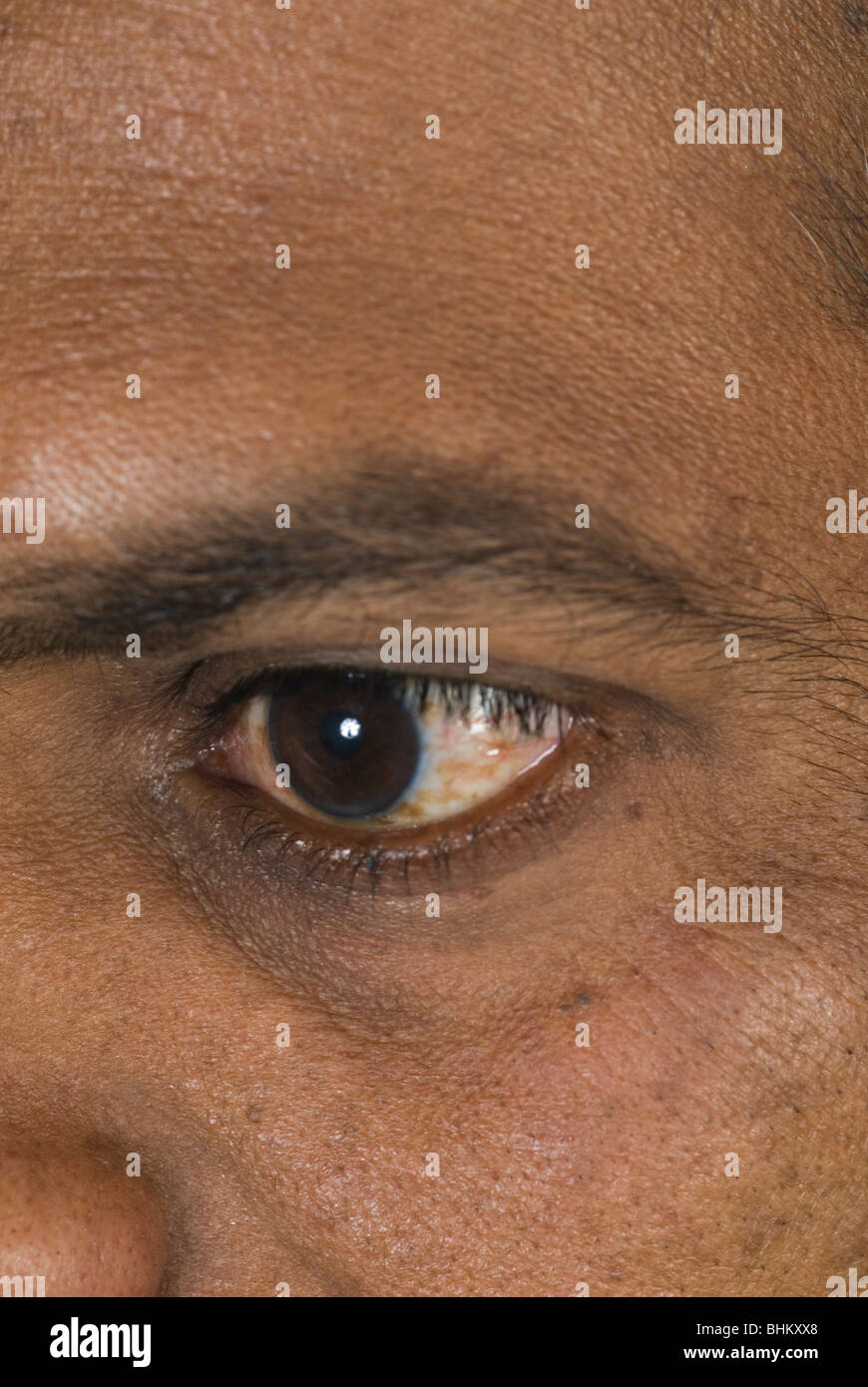 Close up of a serious man's eye looking intensely Stock Photo - Alamy