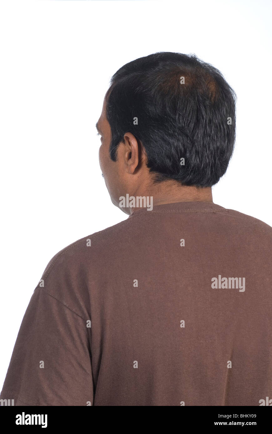 Rear view of an Indian man against a white background Stock Photo - Alamy