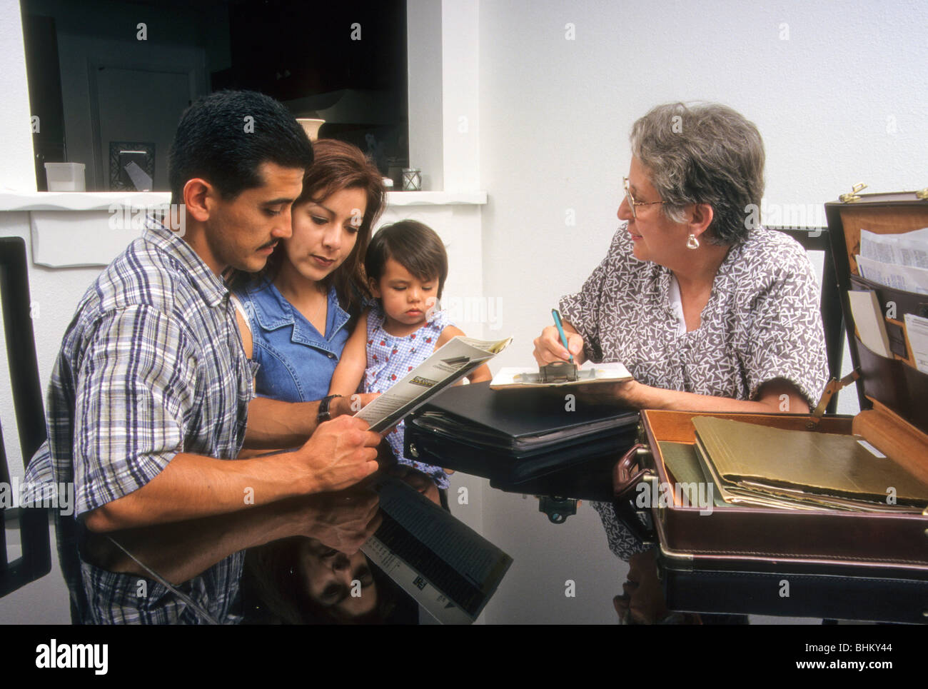 interview Hispanic man woman family child baby talk assist complete ...