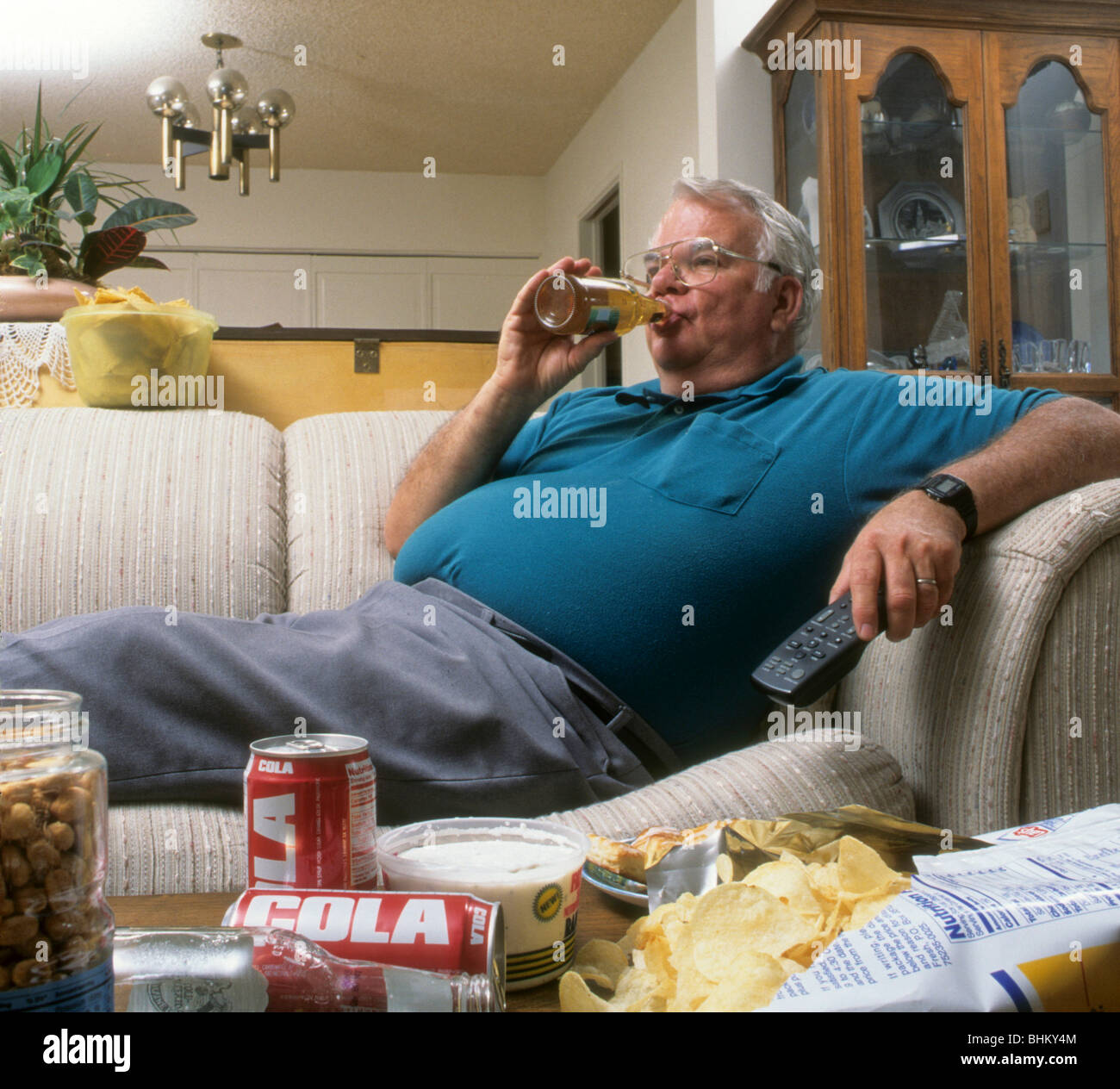 fat overweight obese health heavy large man eat junk food trash lazy ...