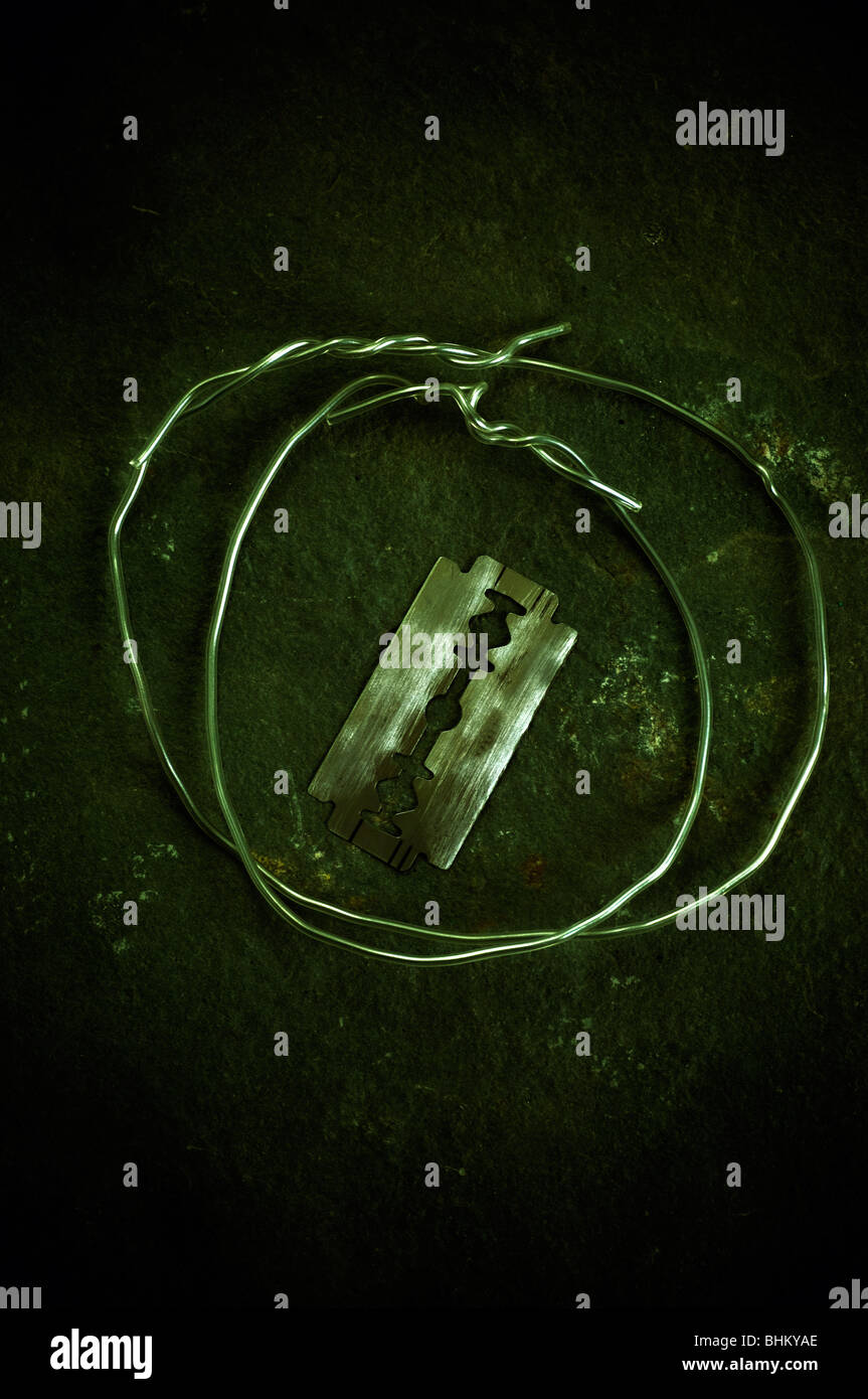 Grunge shaving razor inside a circle of wires Stock Photo - Alamy