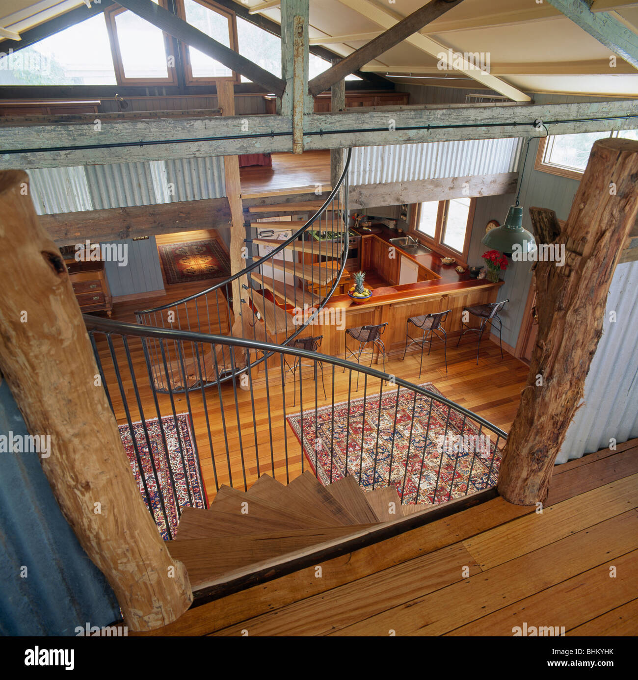 Birdseye view of modern open-plan barn conversion hall with apex roof ...