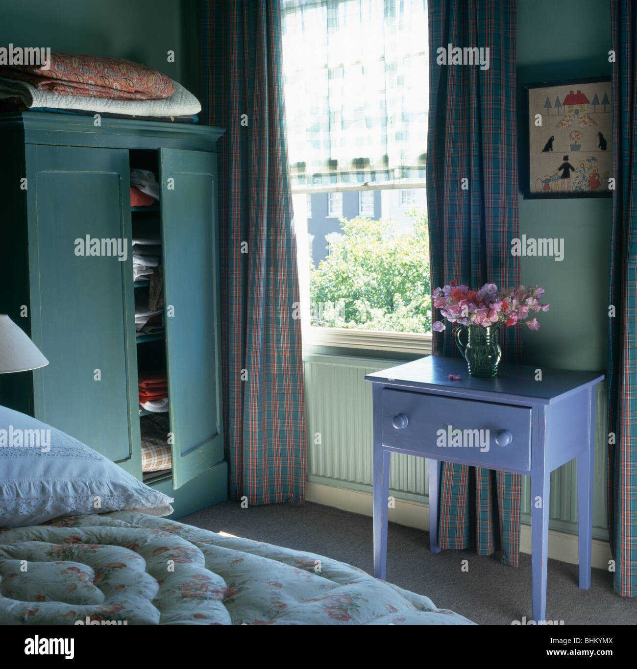 Turquoise wardrobe and pastel blue painted table in small turquoise ...