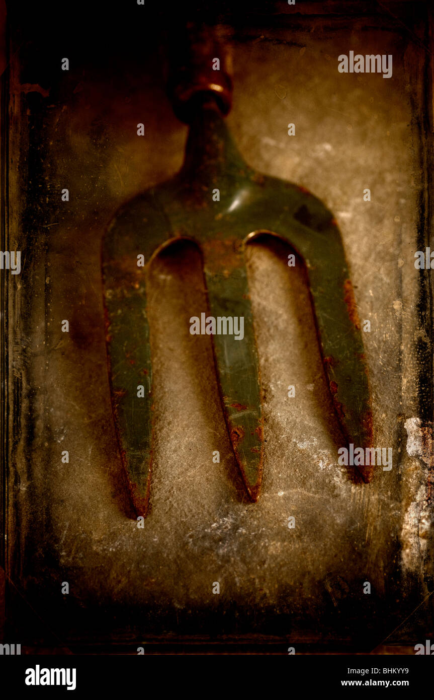 Rusty metal gardening fork Stock Photo - Alamy
