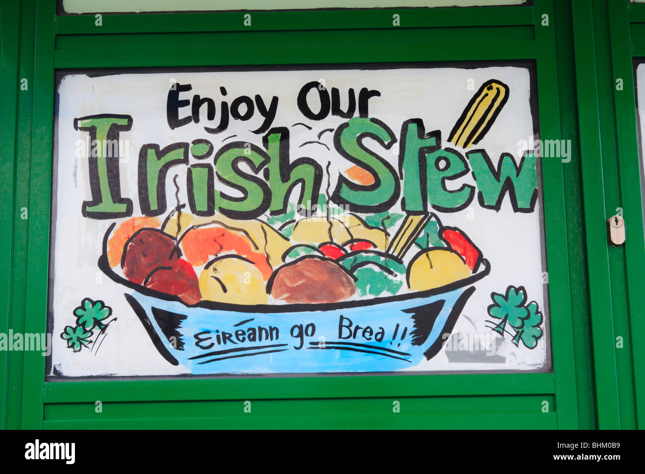 Menu painted on window of Irish bar in Spain Stock Photo - Alamy