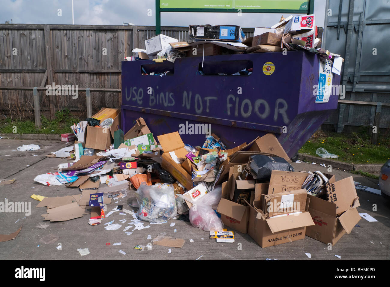 Recyle bin full and overflowing with cardboard and paper Stock Photo ...