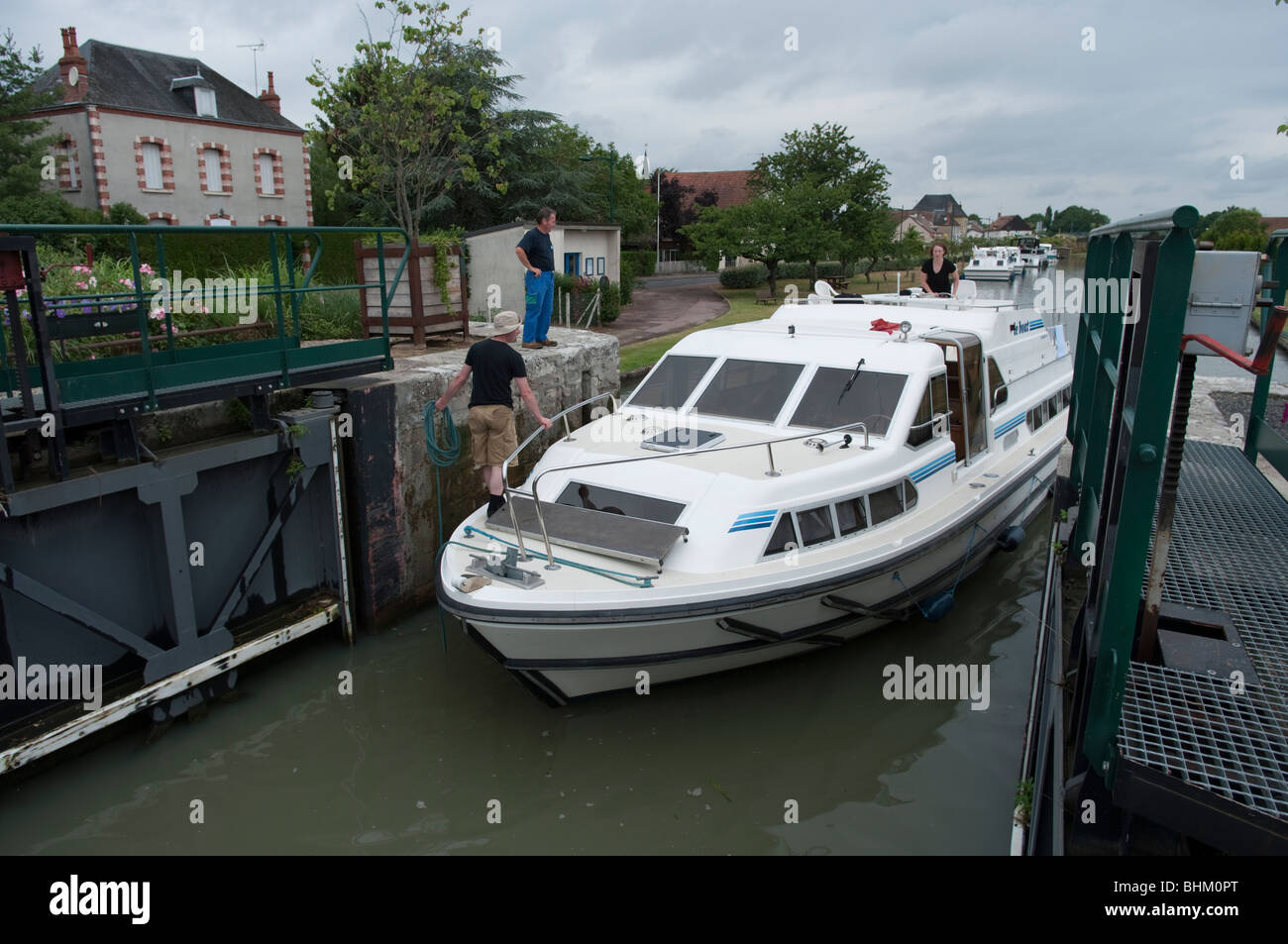 boat goes through lock on the Canal Lateral a la Loire, Cher, France ...