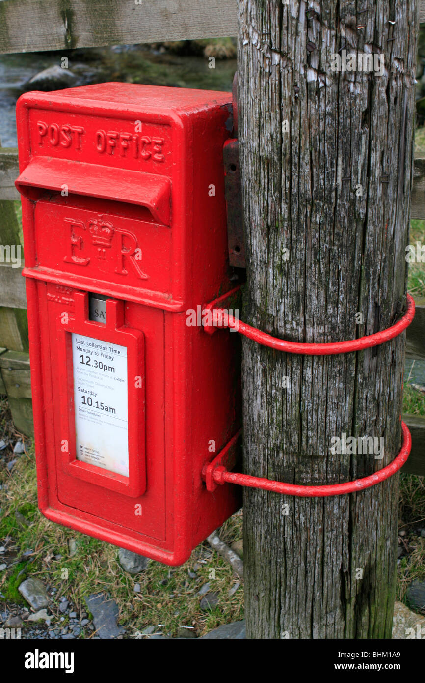 Post Box tied to a wooden post Stock Photo - Alamy