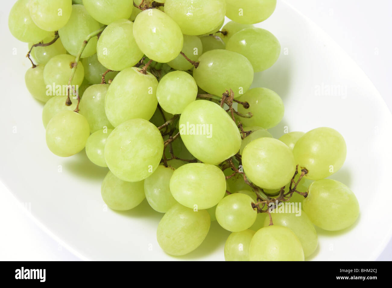 Bunch of Green Grapes on Plate Stock Photo - Alamy