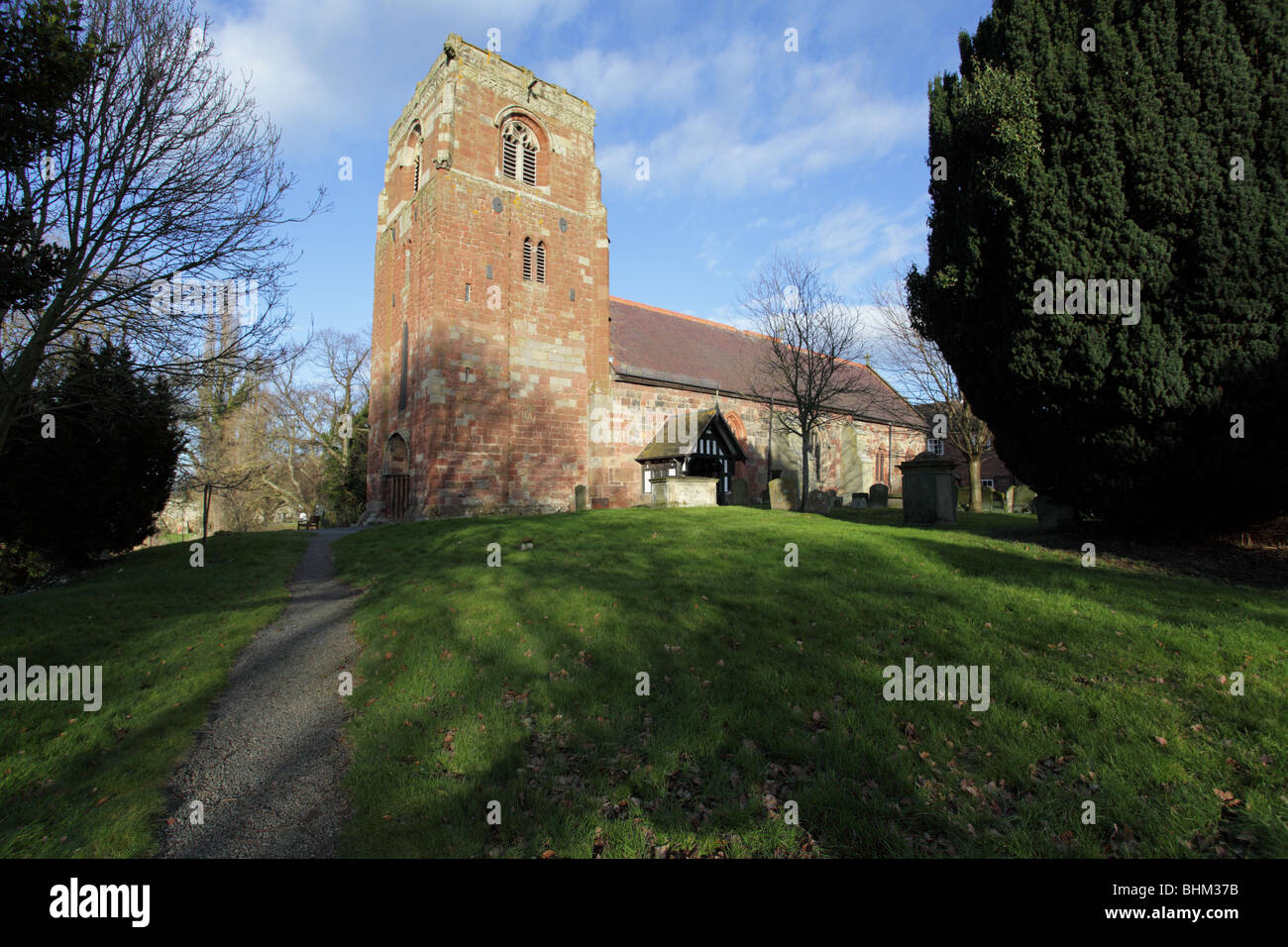 Cast in red sandstone the idyllic Church of St Eata at Atcham in ...