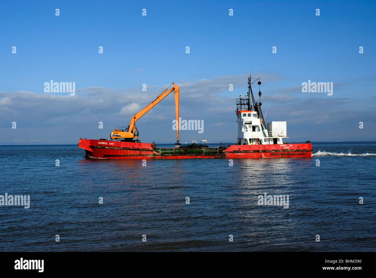 The grab hopper dredger "Admiral Day" on its way out to sea, in ...