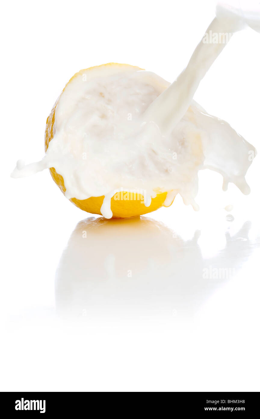 lemon with splashing milk Stock Photo - Alamy