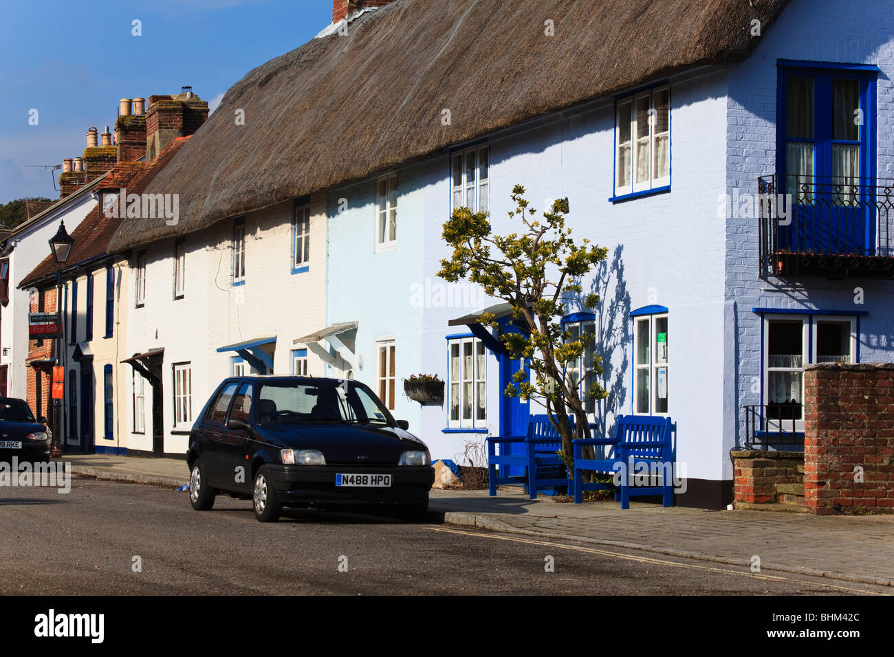 Attractive terrace of thatched cottages in the desirable village of ...