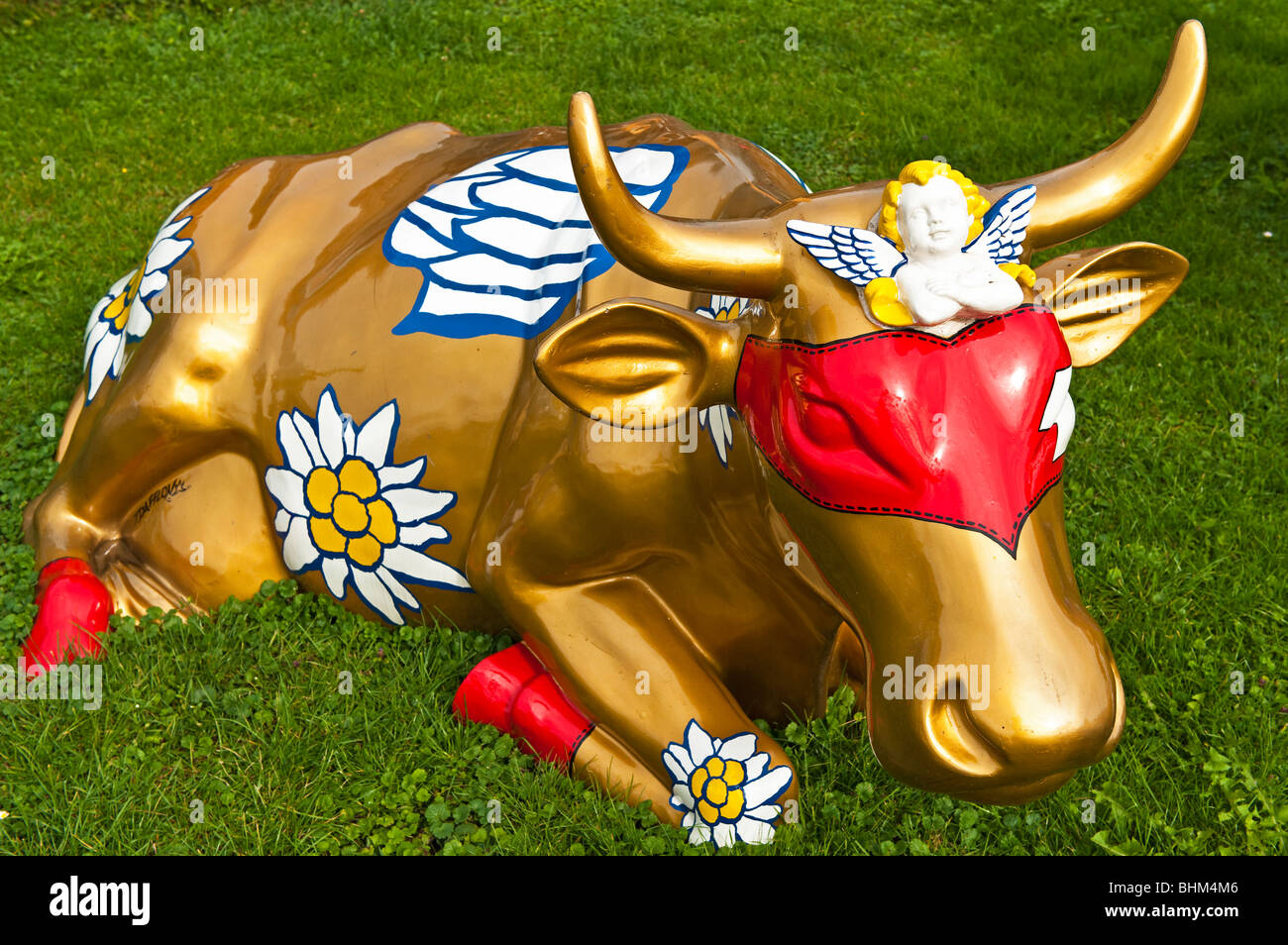 A Swiss promotional gold cow Stock Photo - Alamy