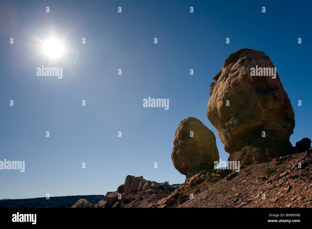 The Sun overlooking the Twin Rocks in Capitol Reef National Park, Utah ...