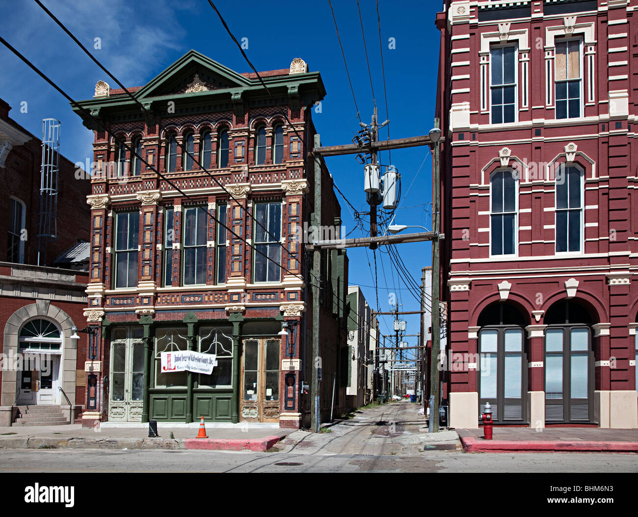 Power lines running through alley between two historic buildings ...