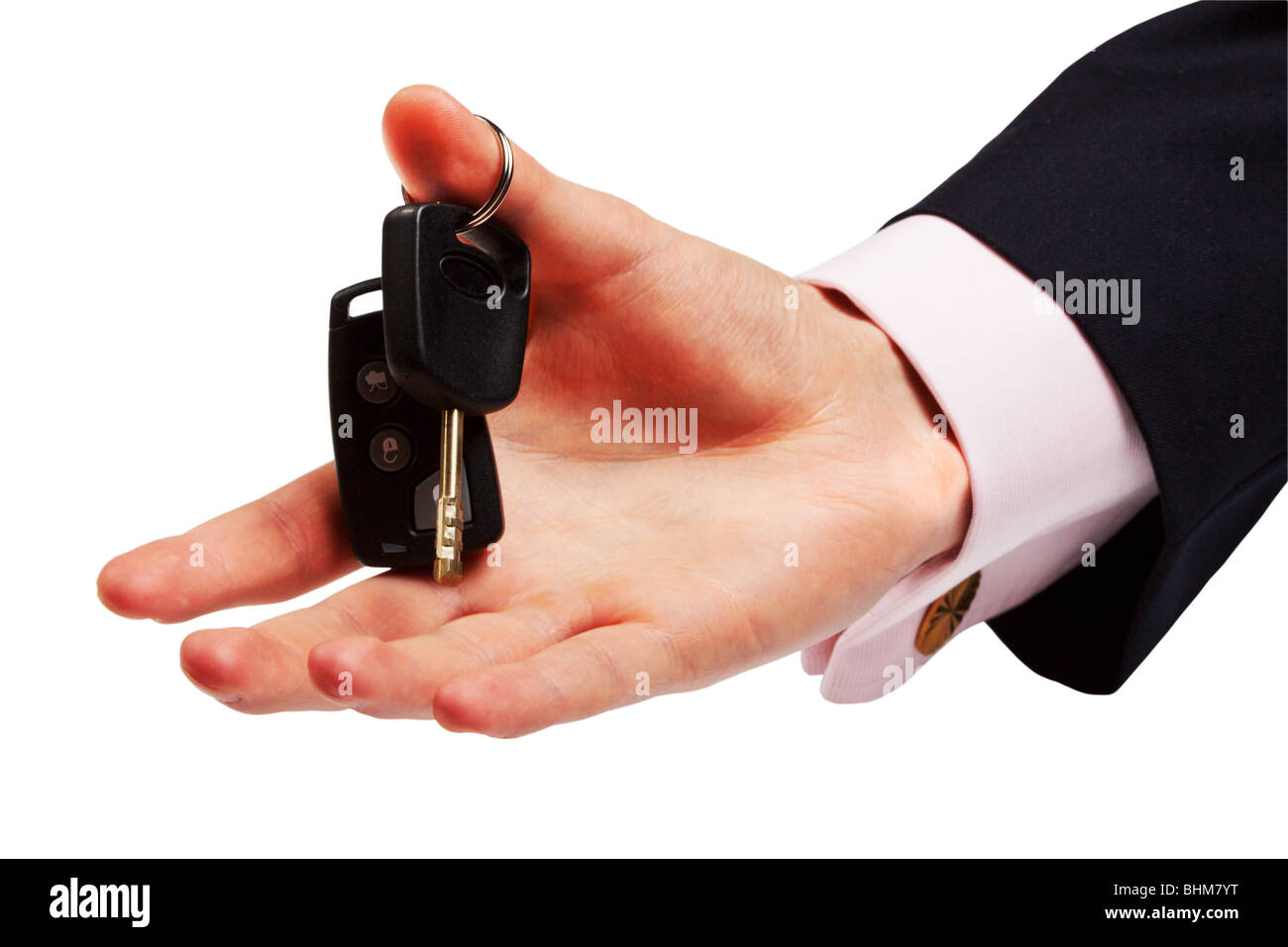 Hand offering key on a white background Stock Photo - Alamy