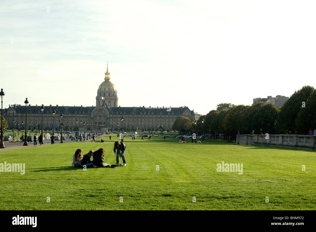 Esplanade des Invalides, Paris, in a sunny autumn day. A group of young ...