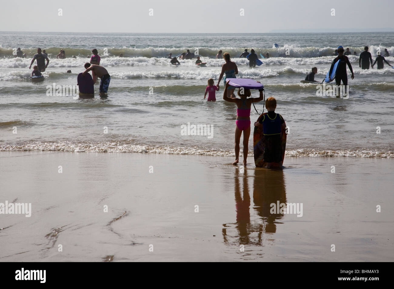People enjoying the surf with body boards on the North Devon coast ...
