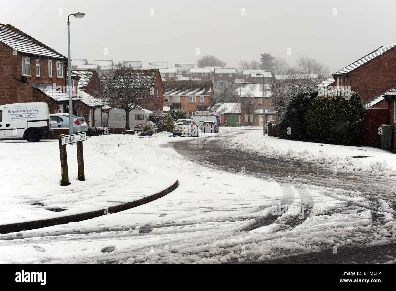 Road through a small housing estate in peacehaven covered in snow Stock ...