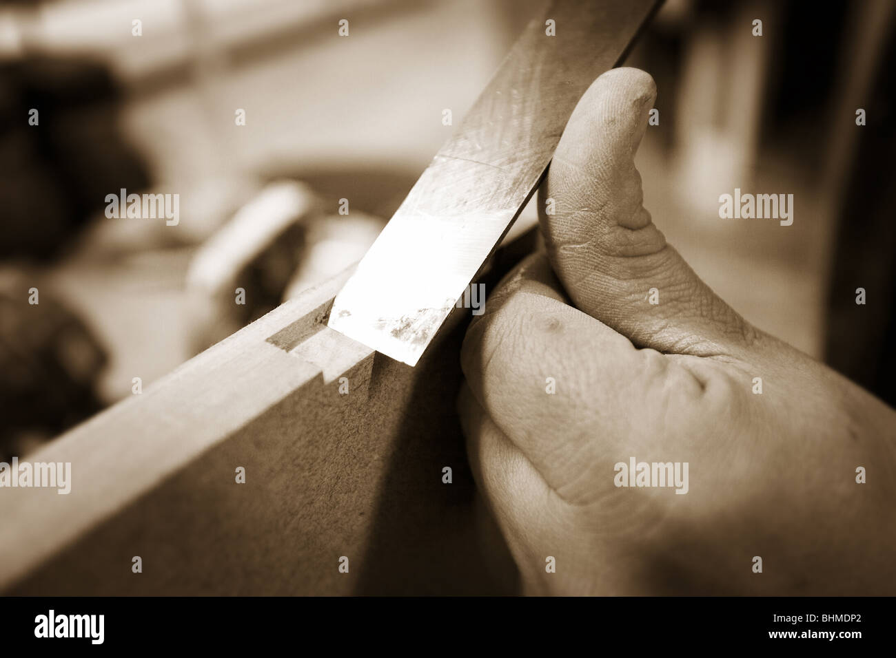 Man using a chisel to make a joint Stock Photo - Alamy
