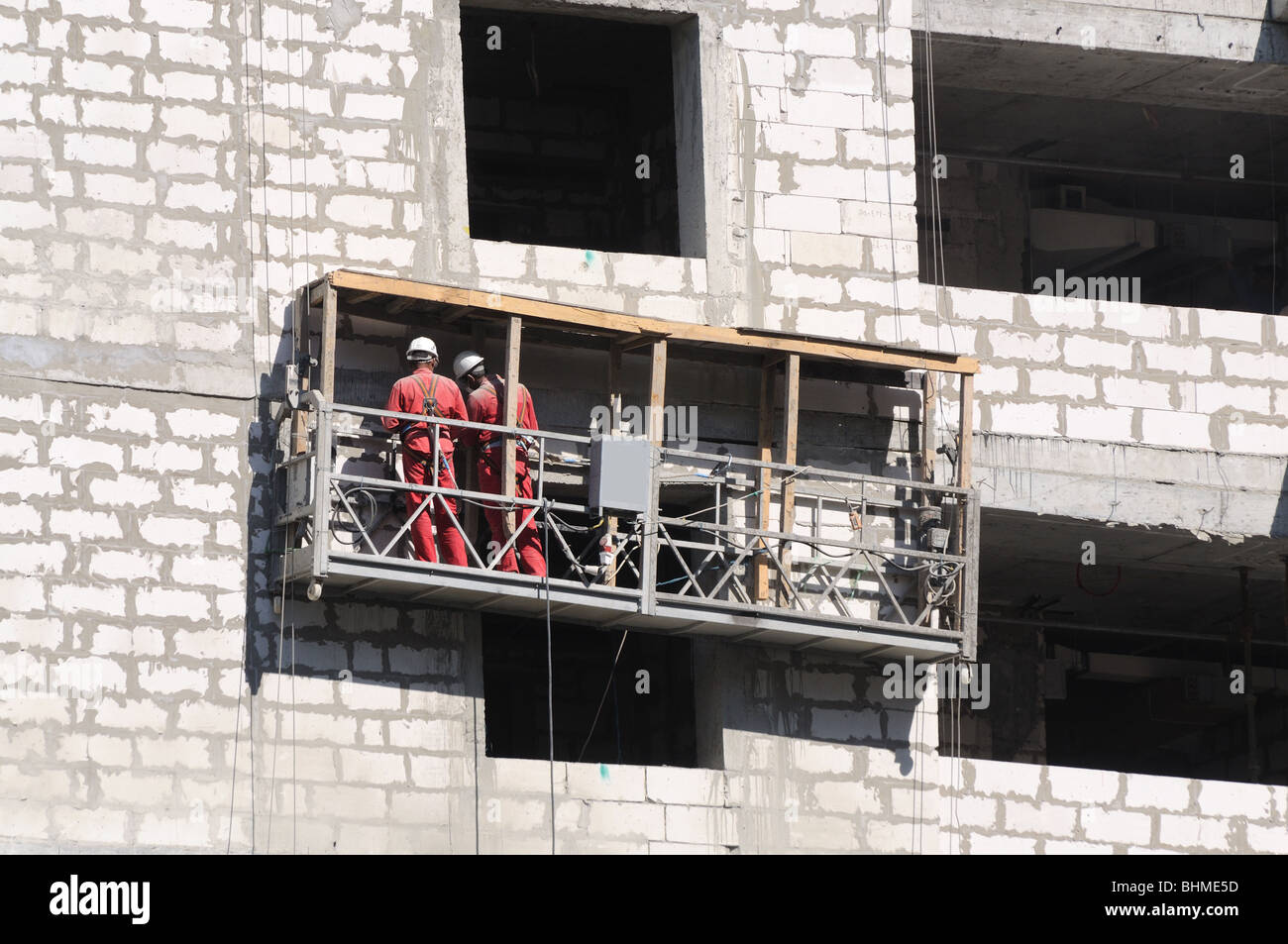 Exterior work at an unfinished building Stock Photo - Alamy