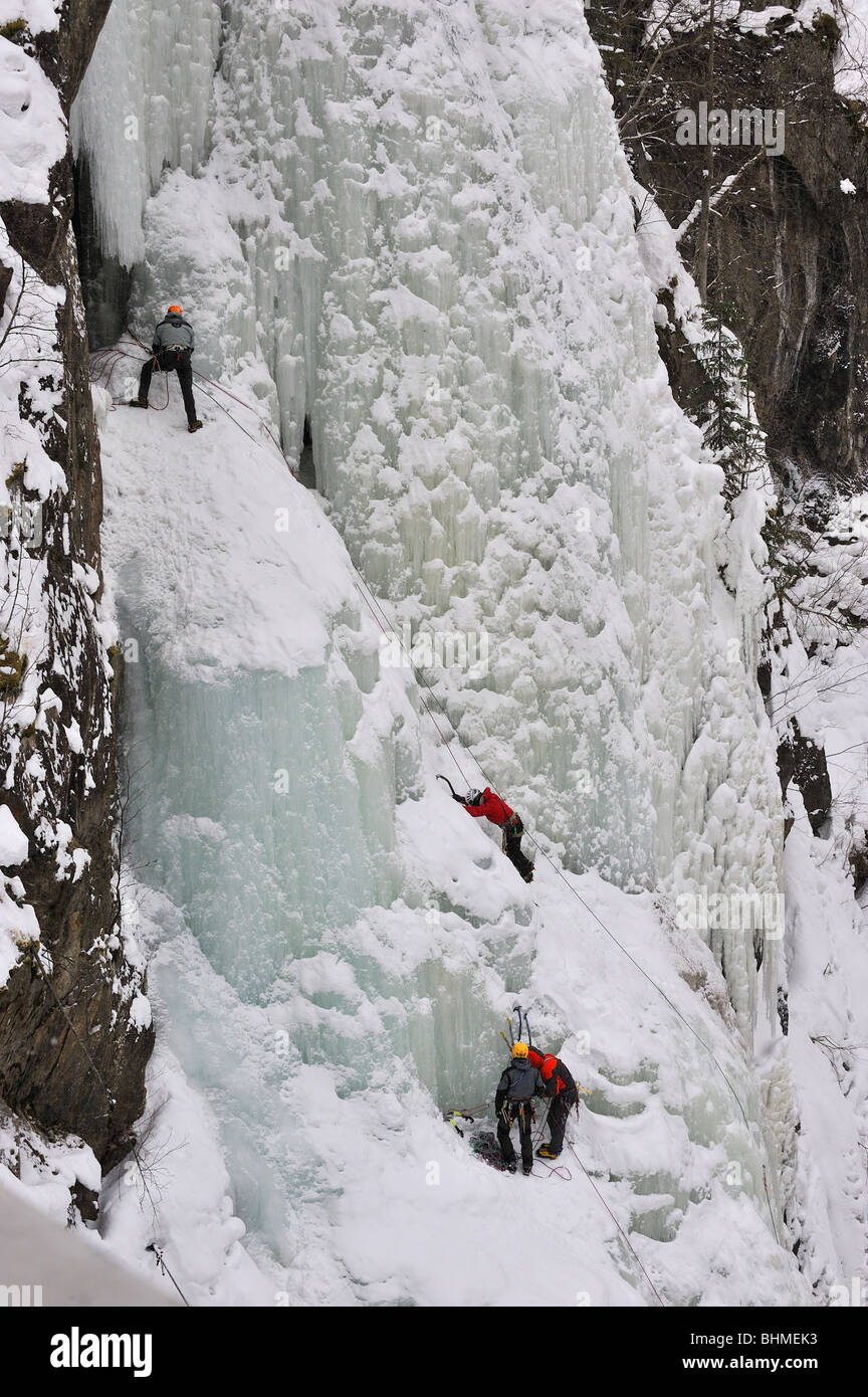 Ice climber at a frozen waterfall hi-res stock photography and images ...