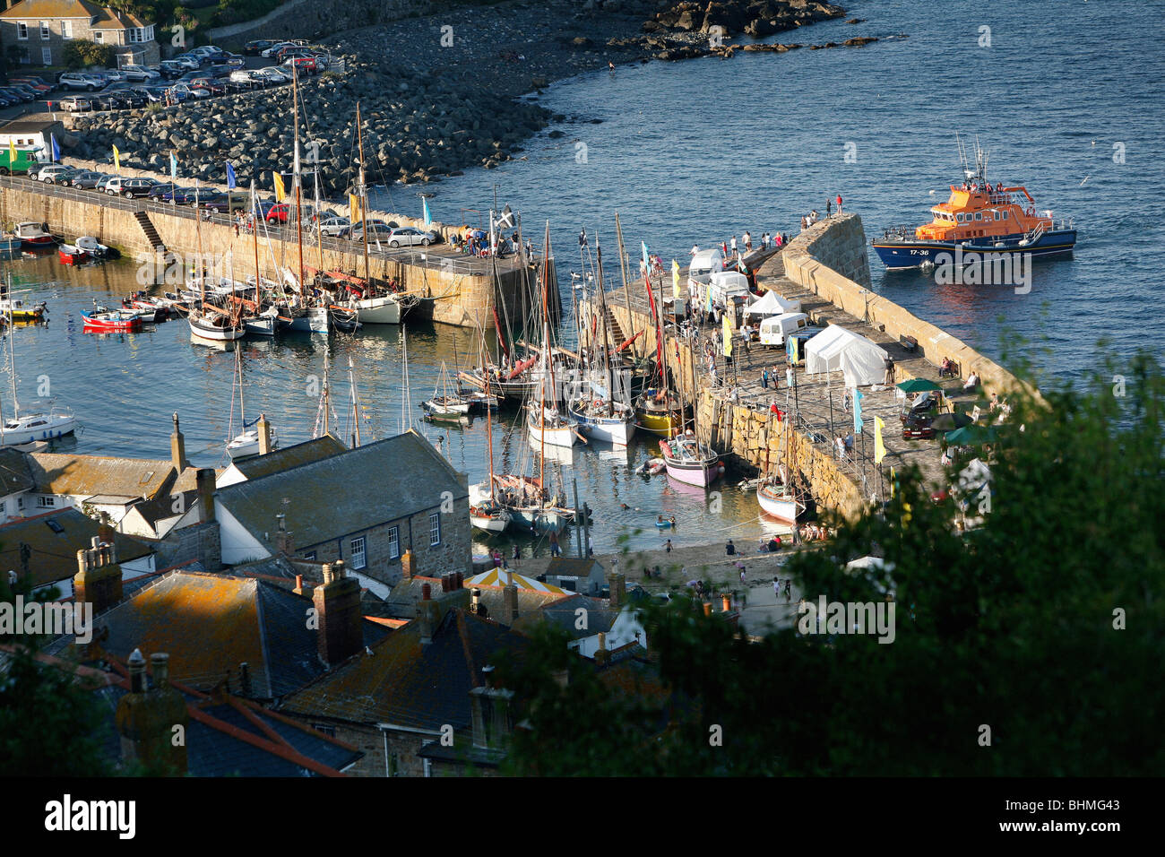 Lifeboat coming into Mousehole harbour Stock Photo - Alamy