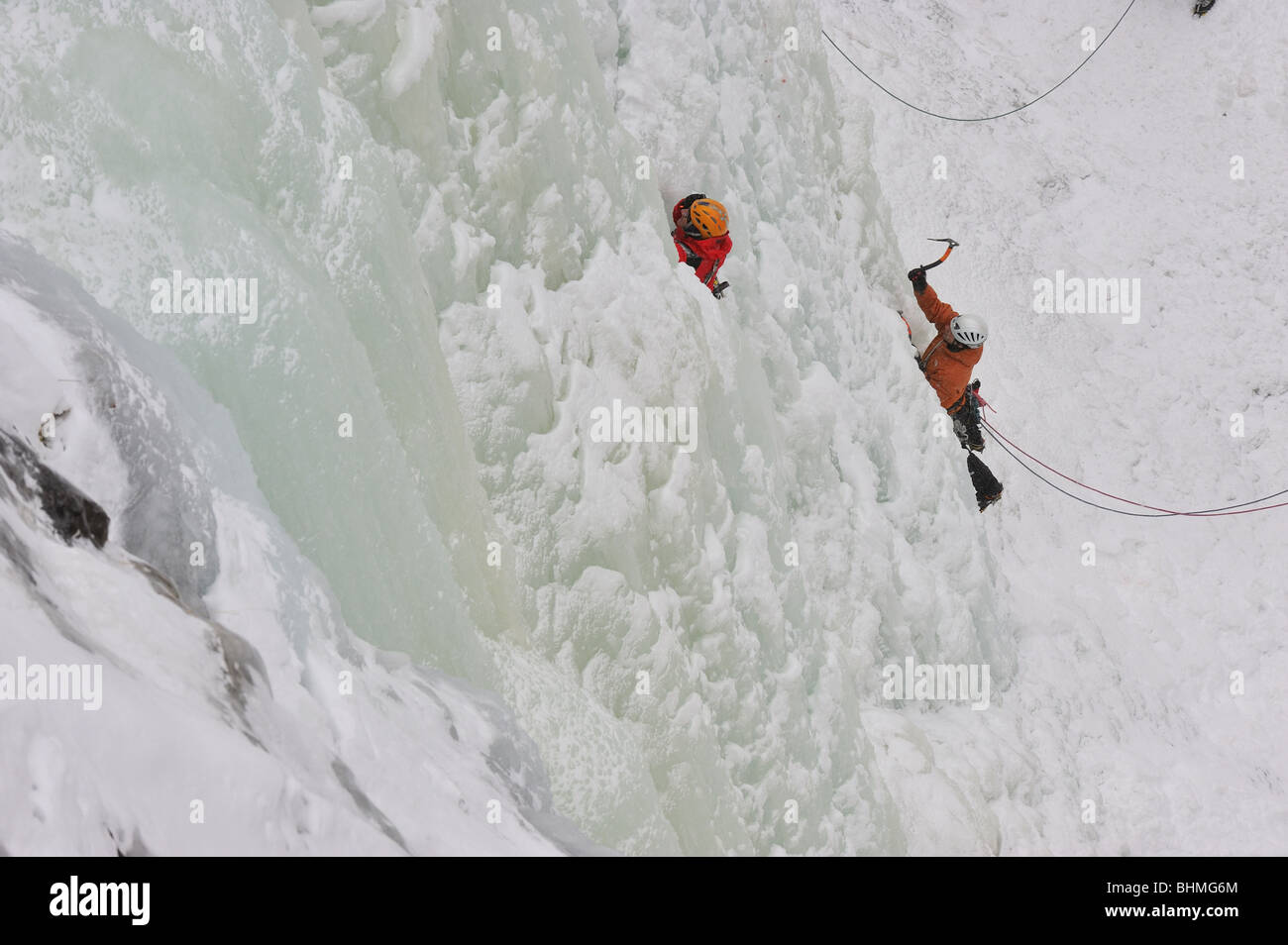 two people climbing a waterfall Stock Photo - Alamy