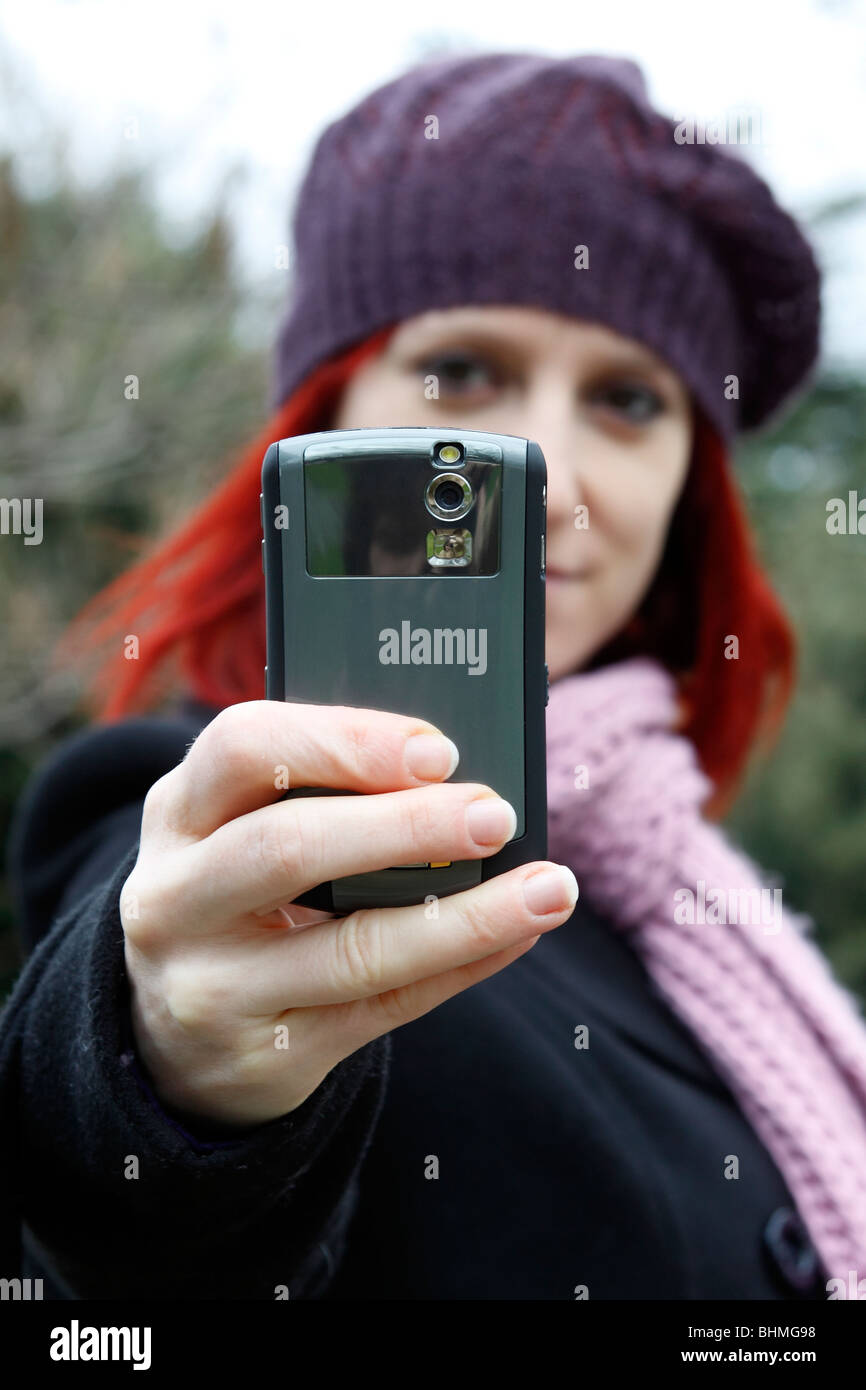 Young woman taking cellphone hi-res stock photography and images - Alamy