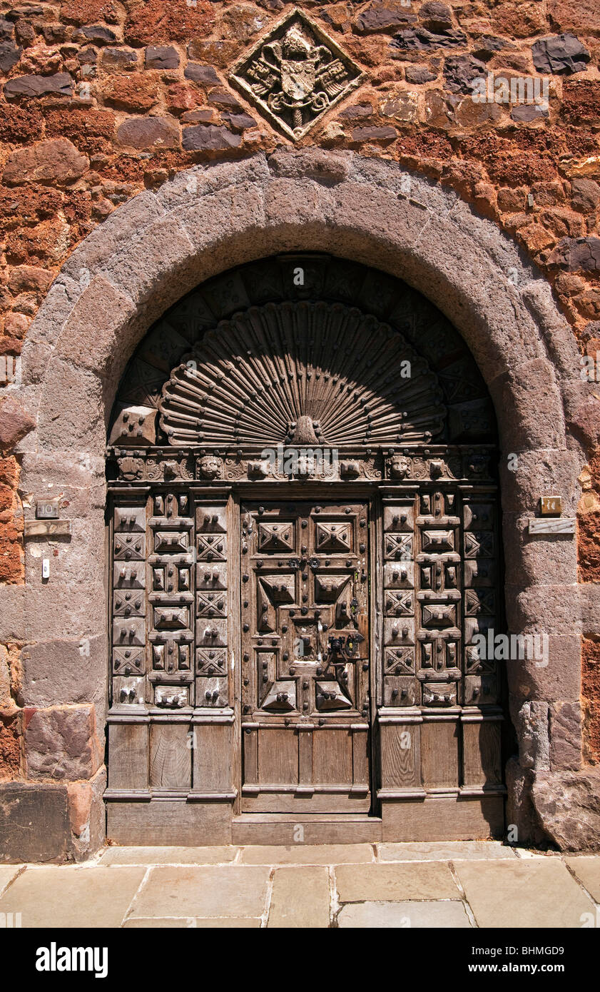 A fine decorated door in the courtyard of Exeter Cathedral in Devon ...