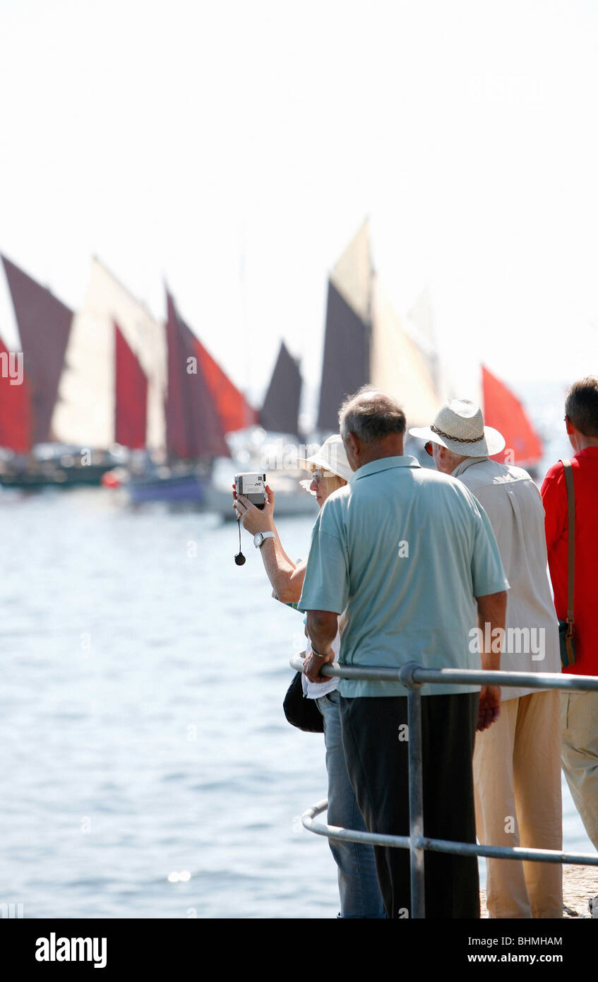 Traditional Cornish fishing boats sailing in the sea in Mousehole for ...