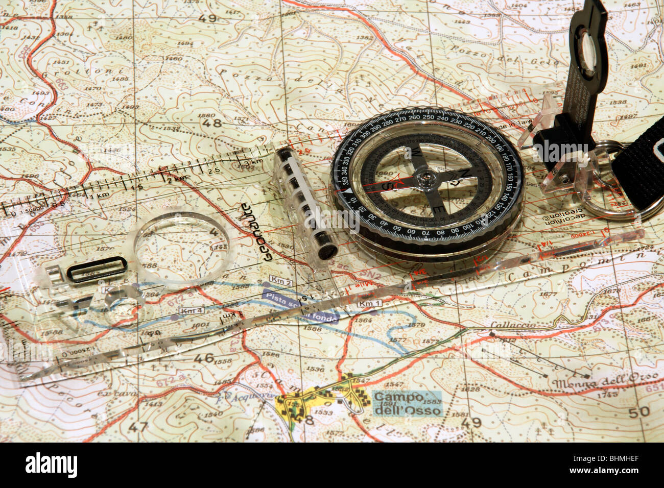 A compass on a road map Stock Photo - Alamy