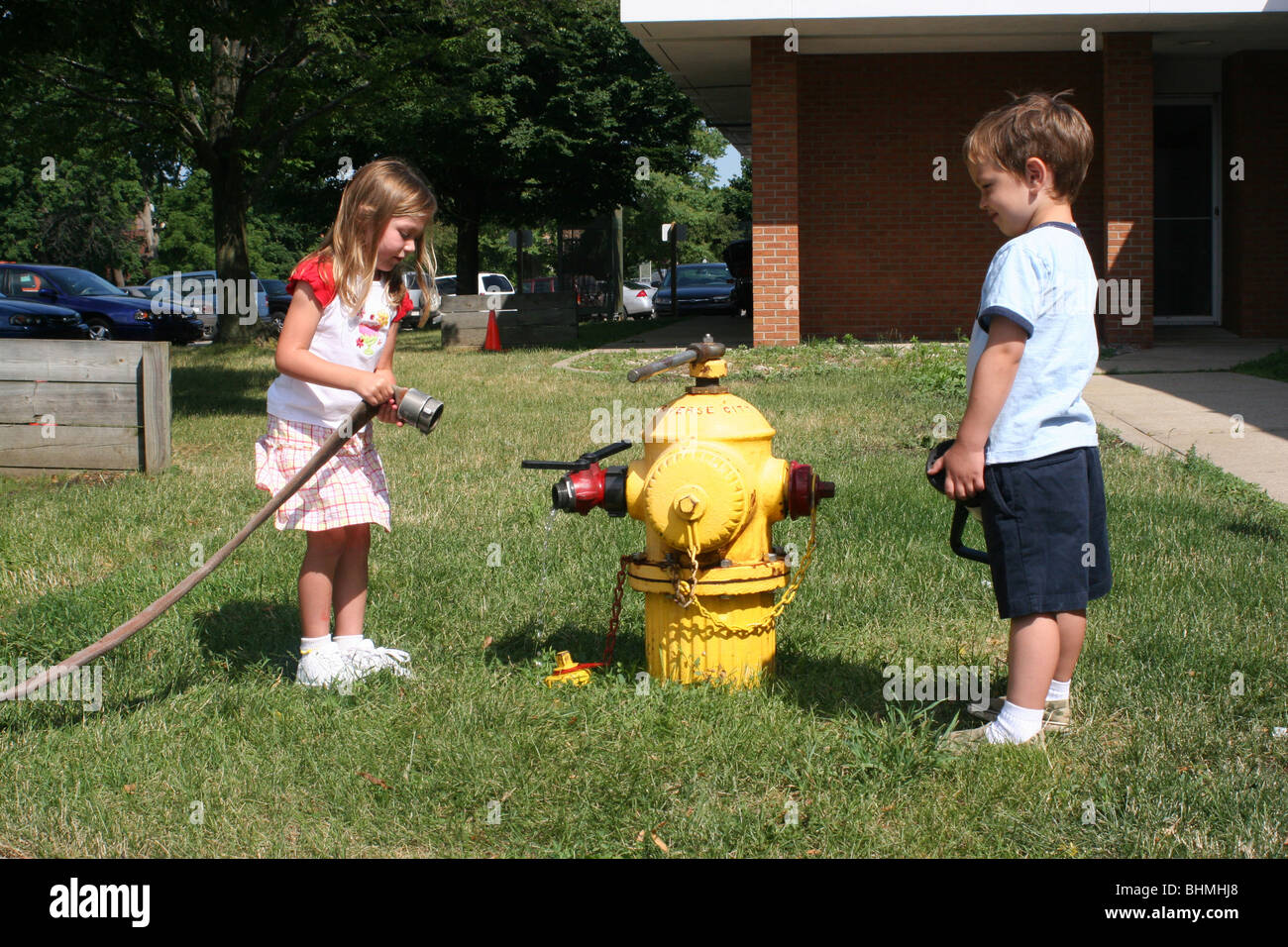 Children playing fire hydrant hi-res stock photography and images - Alamy