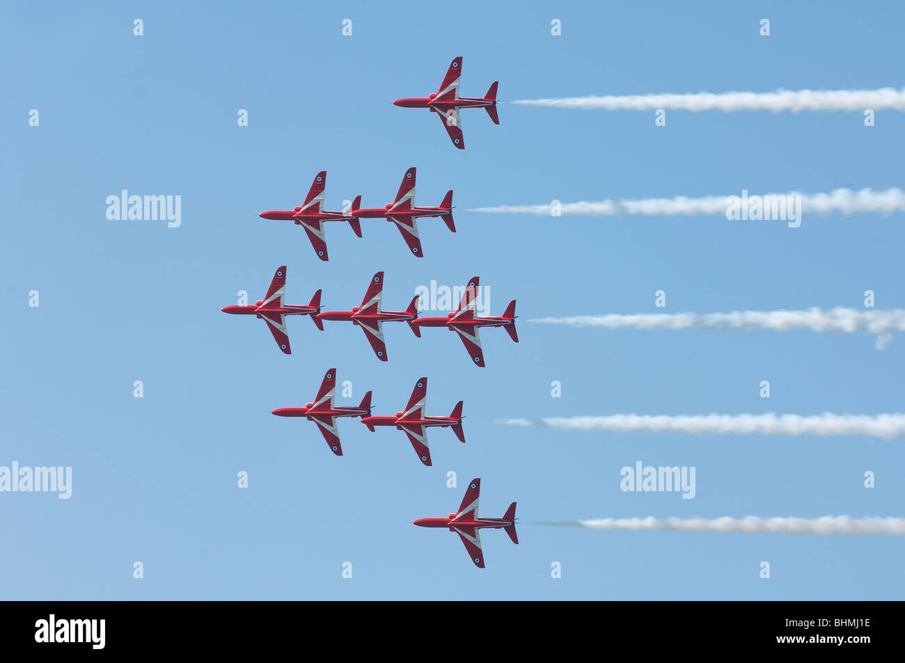 red arrows fly flight display over smoke formation Stock Photo - Alamy