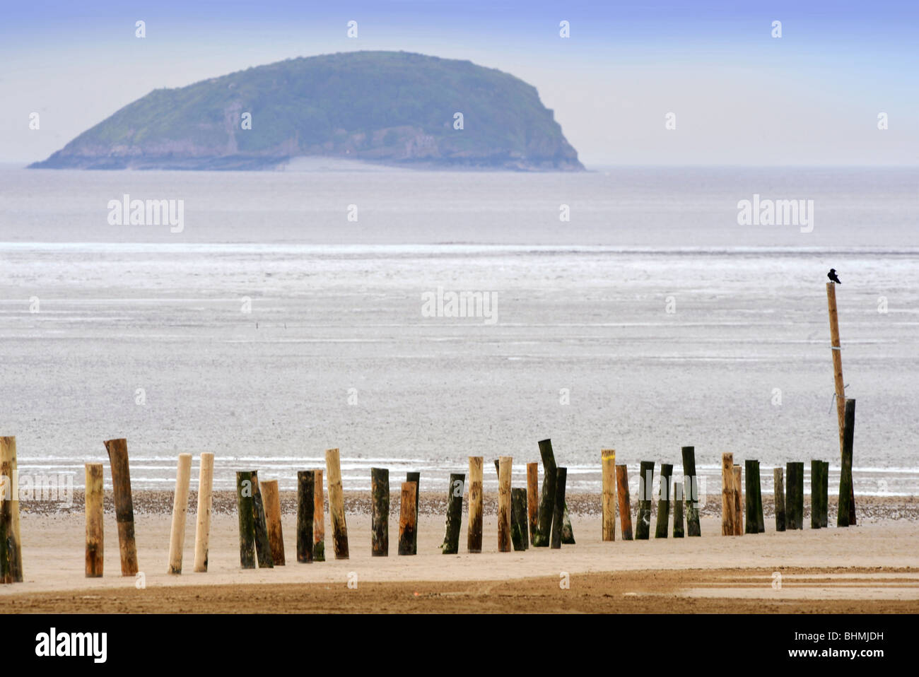 A groyne on the beach with Steep Holm Island at Weston Super Mare ...