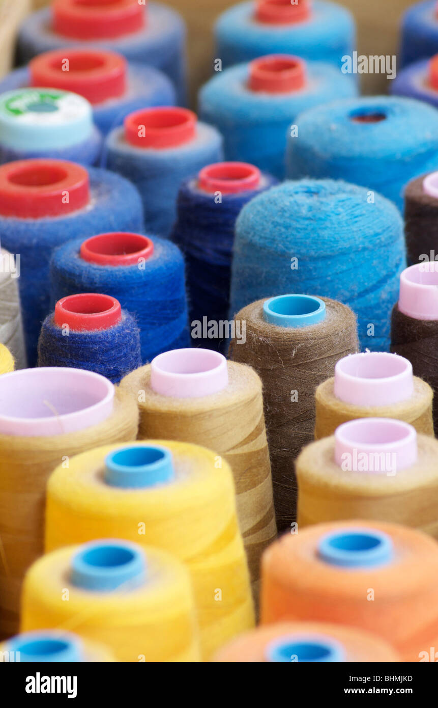 assorted colors of thread on reels Stock Photo - Alamy