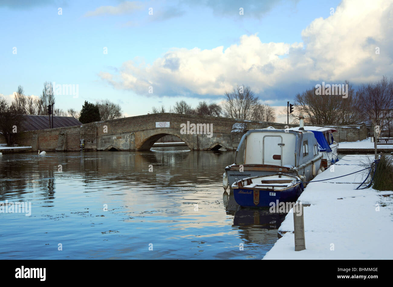 A winter scene with moored boat by Potter Heigham bridge on the River ...