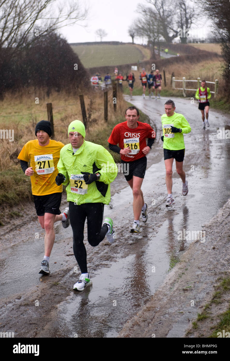 running in bad weather great east race 2010 Stock Photo - Alamy