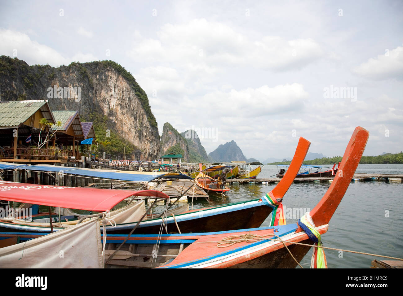 Boats and pier at Panyi island - Phang Nga Bay - Thailand Stock Photo ...