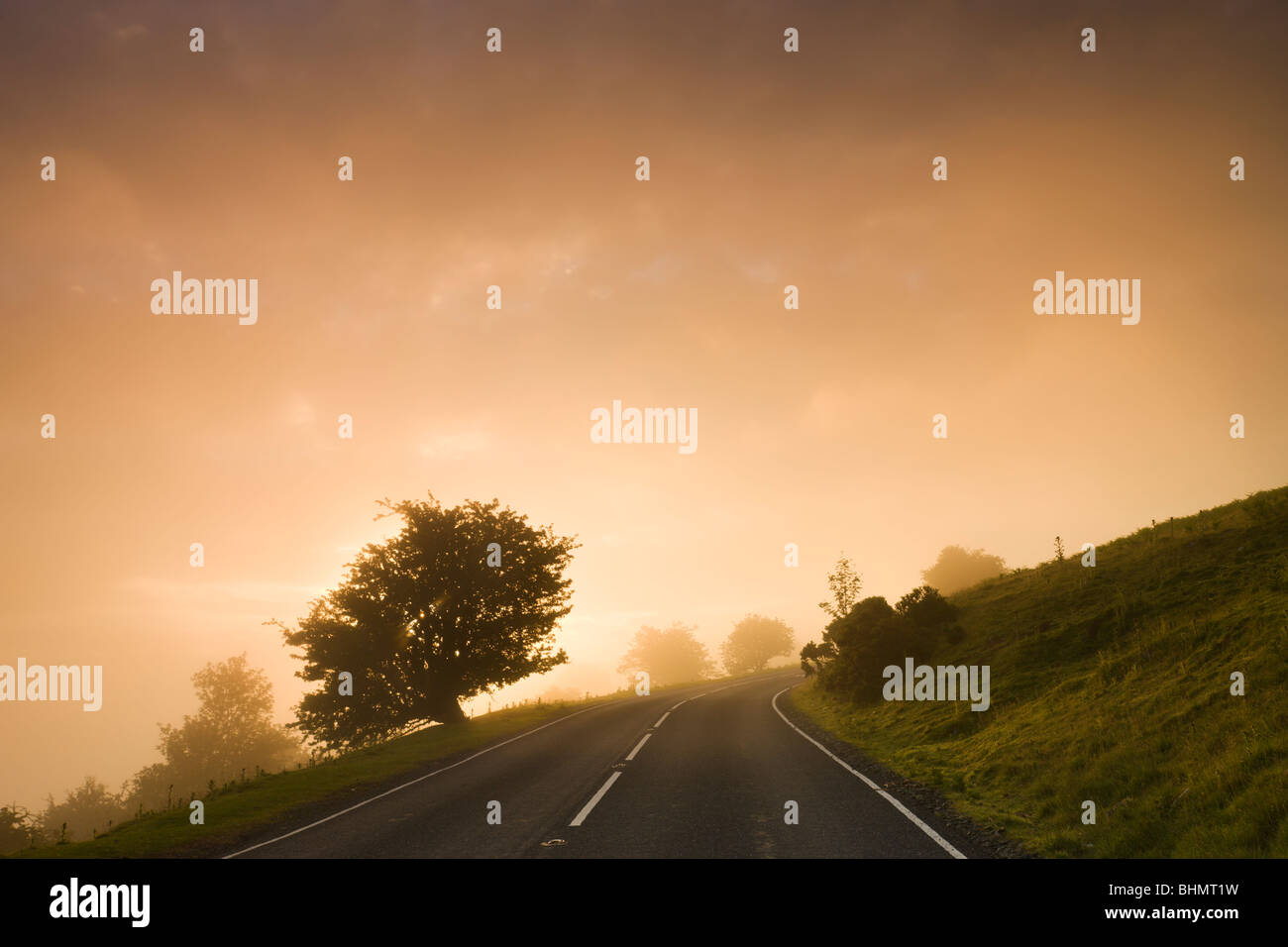 Misty conditions at sunrise on a moorland road, Brecon Beacons National ...