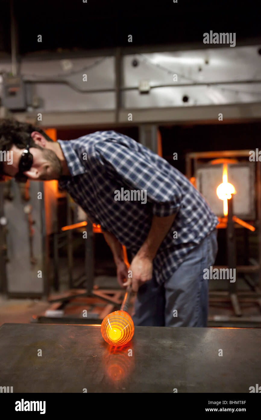 Detroit, Michigan - Paul Abowd works on a glass bowl at the Michigan ...