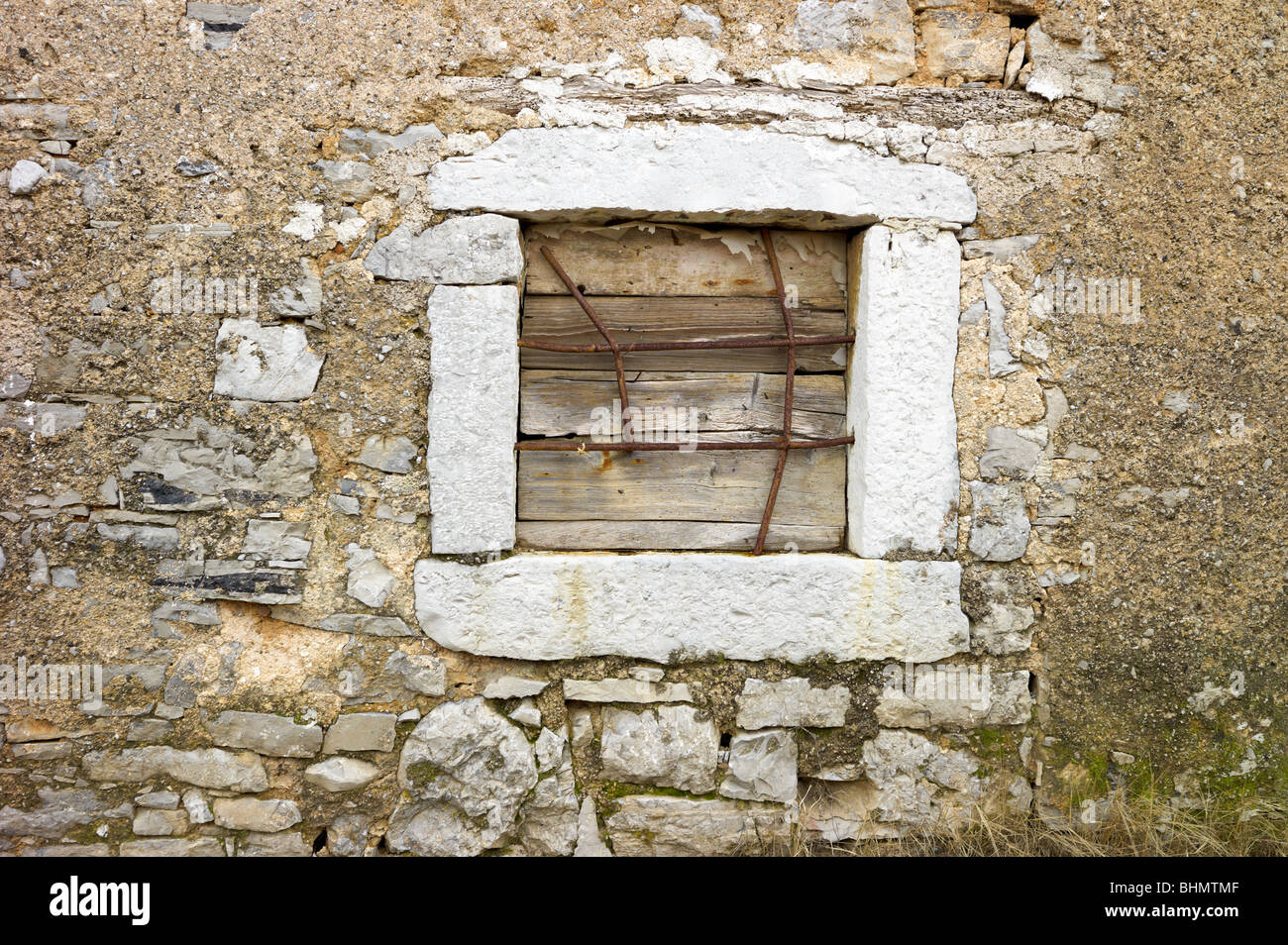 Stone window with iron cros Stock Photo - Alamy