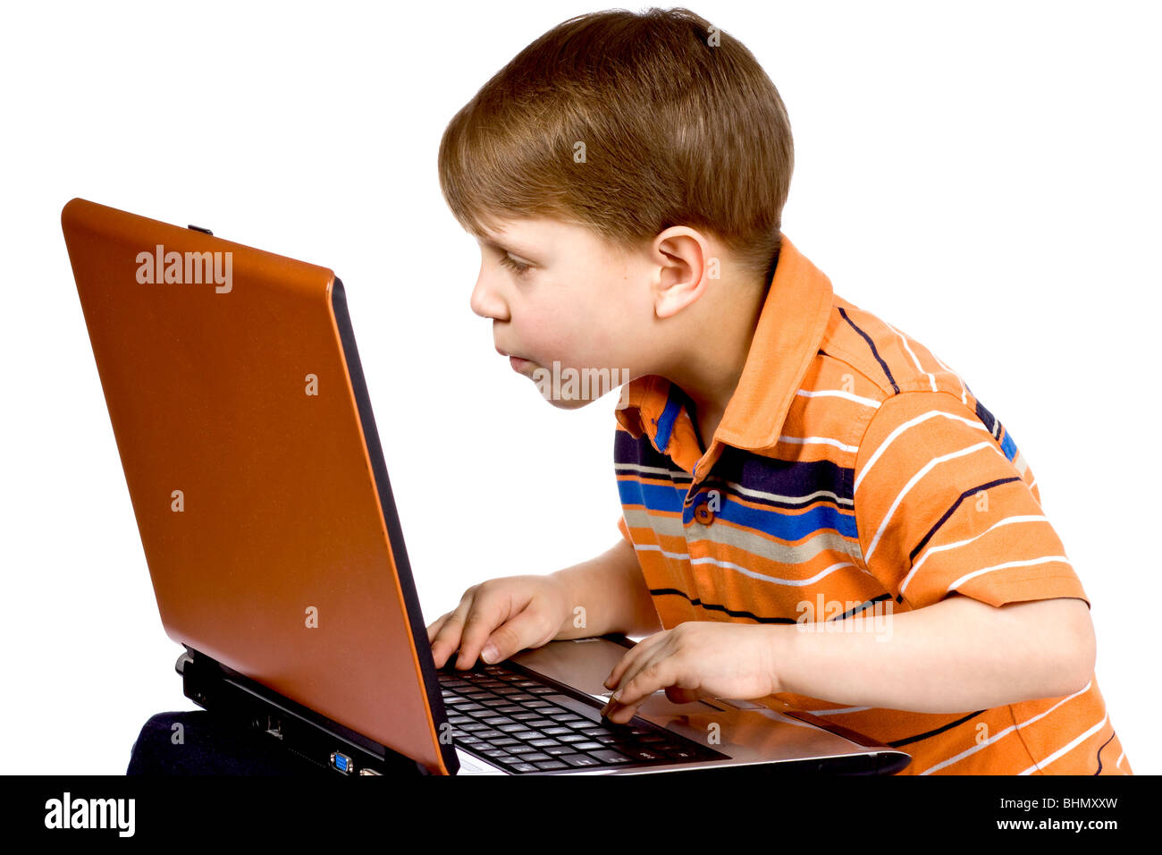 Young boy looking staff in to computer, laptop Stock Photo - Alamy